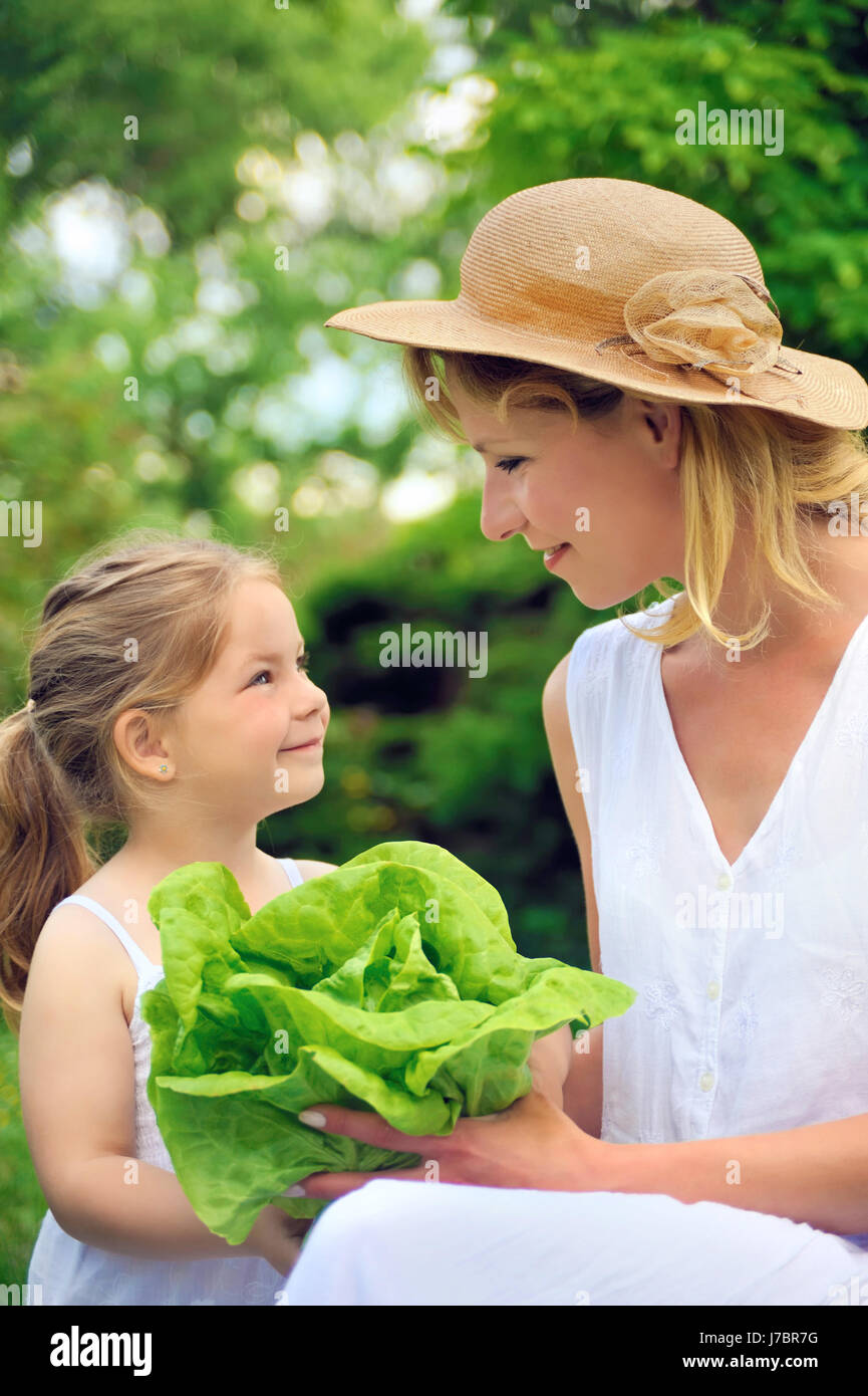Family working in community garden hi-res stock photography and images ...