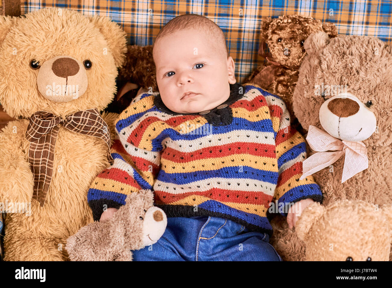 Baby and teddy bears. Infant boy with soft toys Stock Photo - Alamy