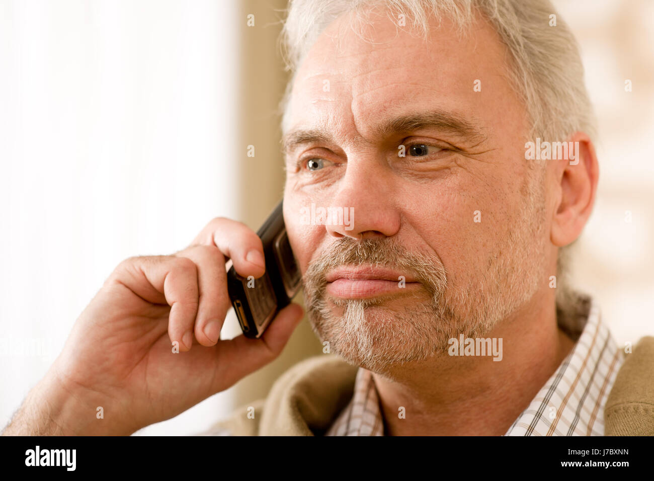 call lifestyle portrait thoughtful man senior senior citizen elderly ...
