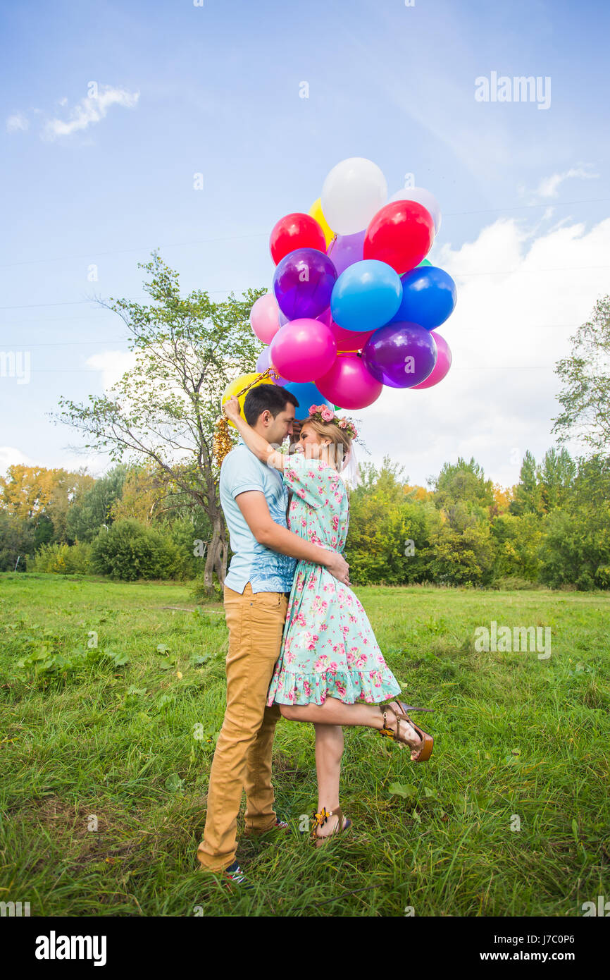 summer holidays, celebration and dating concept - couple with colorful ...