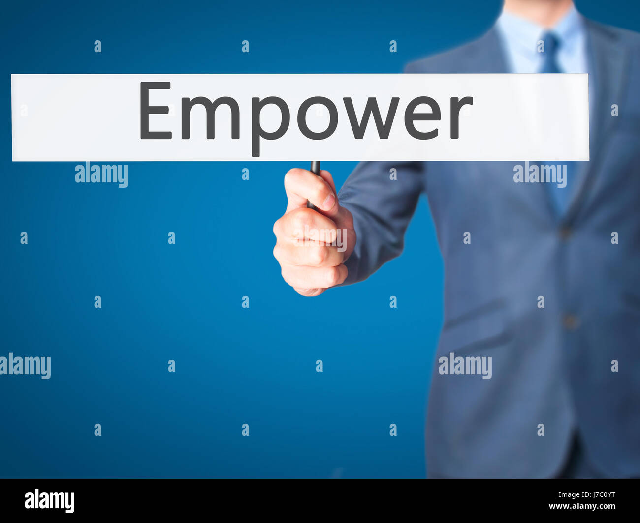 Empower - Businessman hand holding sign. Business, technology, internet ...