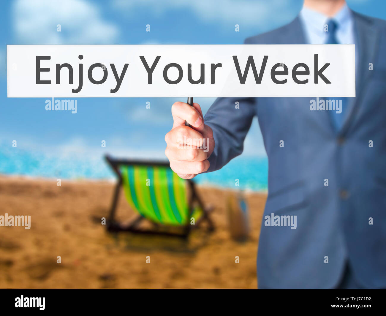 Enjoy Your Week - Businessman hand holding sign. Business, technology ...