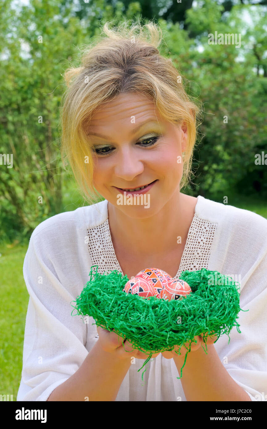 woman easter egg eggs young younger woman humans human beings people ...