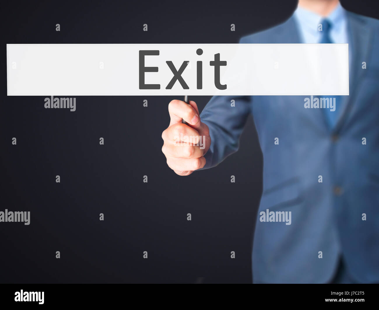 Exit - Businessman hand holding sign. Business, technology, internet ...