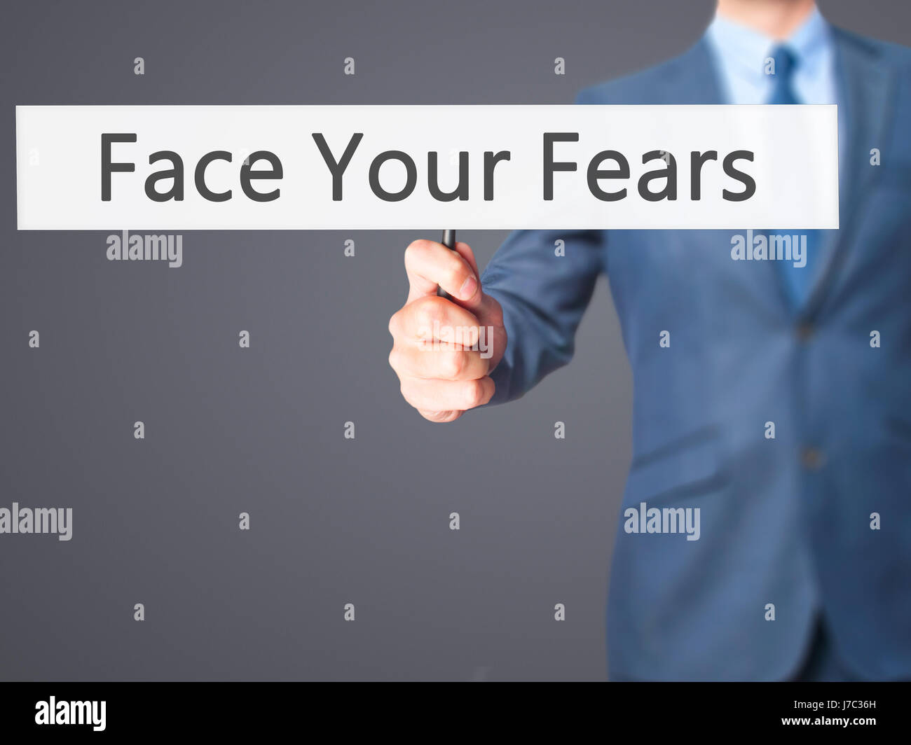 Face Your Fears - Businessman hand holding sign. Business, technology ...