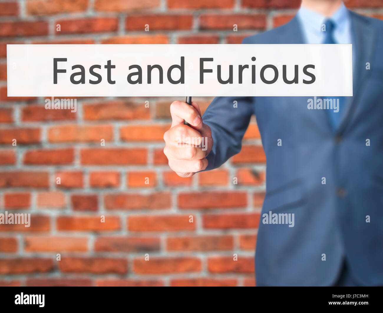Fast and Furious - Businessman hand holding sign. Business, technology ...