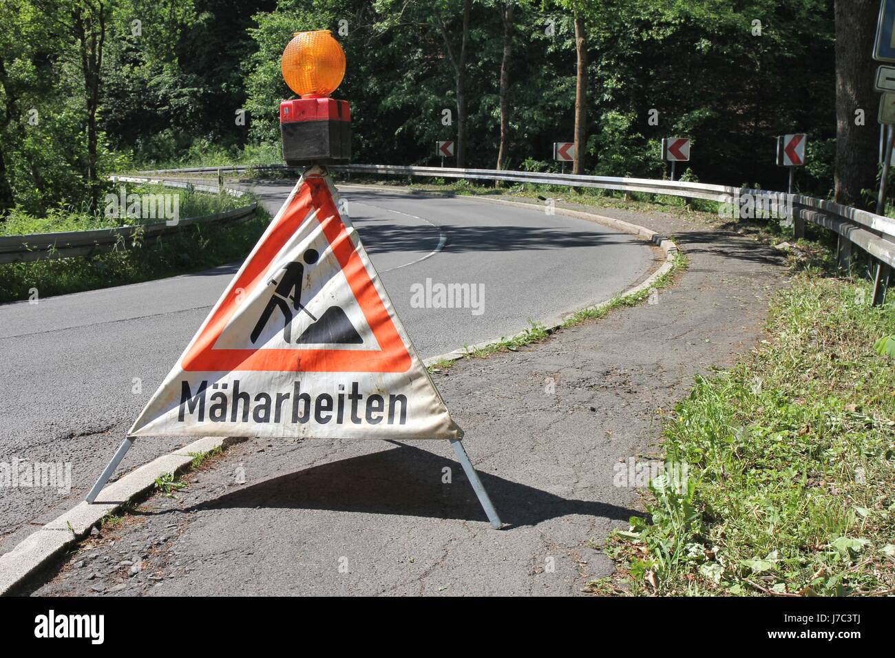 German road sign: construction site - mowing Stock Photo - Alamy