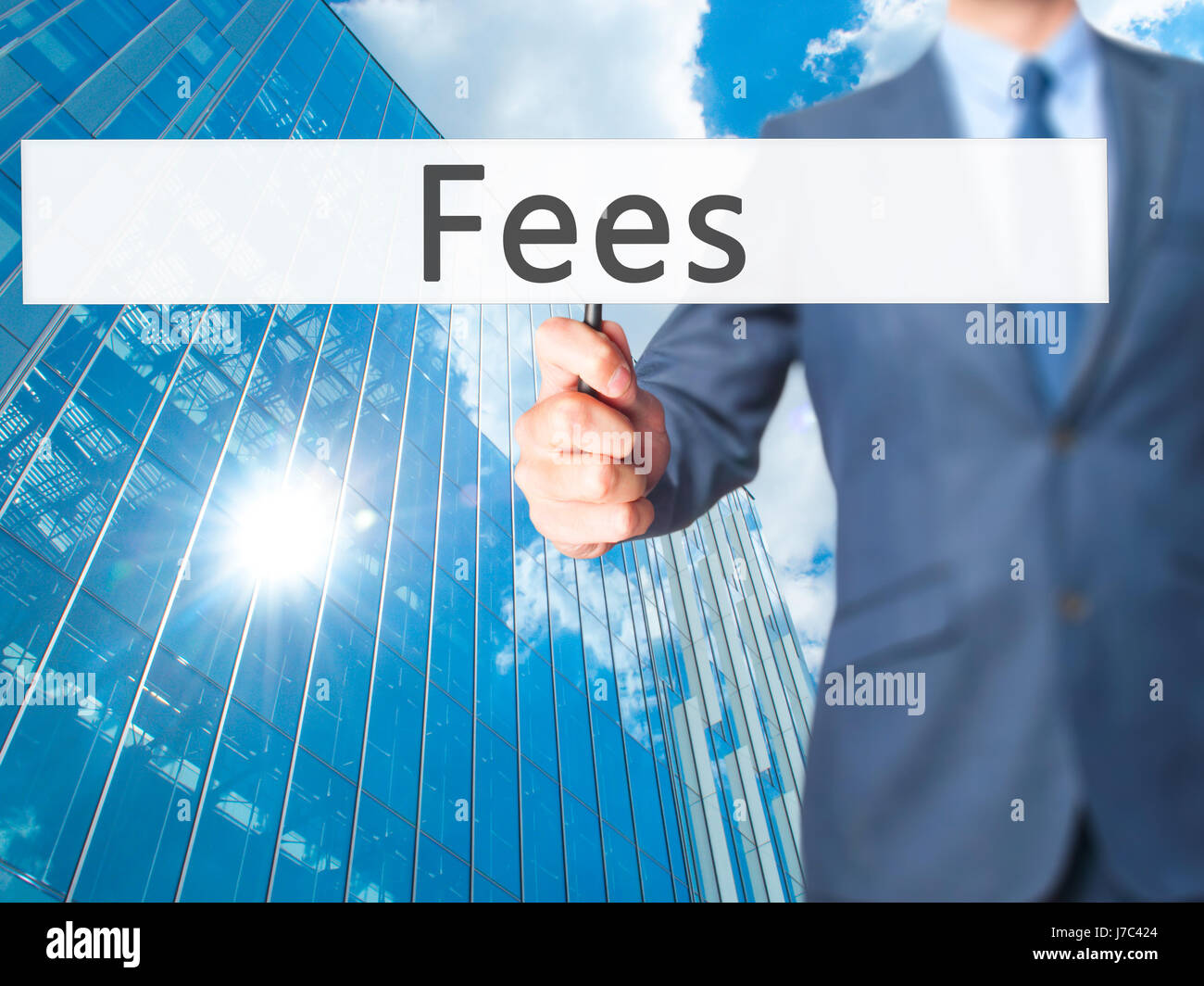 Fees - Businessman hand holding sign. Business, technology, internet ...