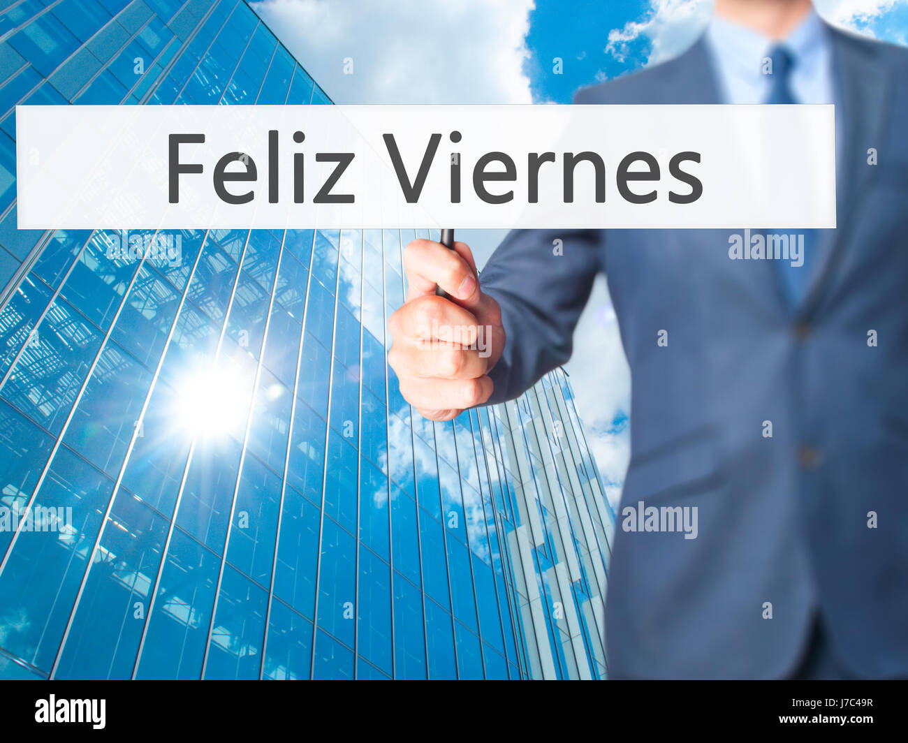 Feliz Viernes (Happy Friday In Spanish) - Businessman hand holding sign ...