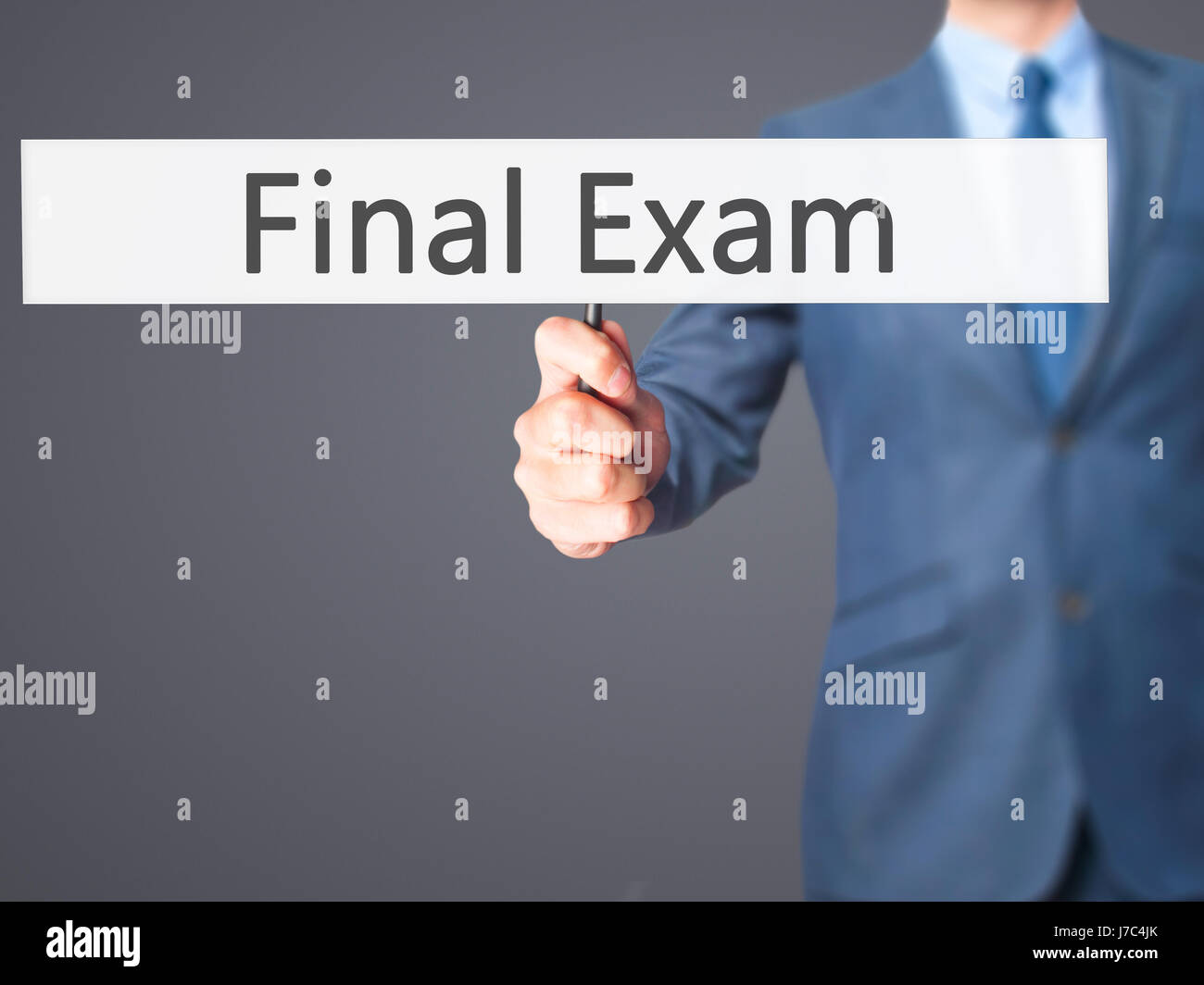 Final Exam - Businessman hand holding sign. Business, technology ...