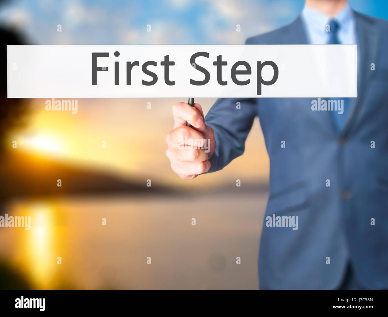 First Step - Businessman hand holding sign. Business, technology ...