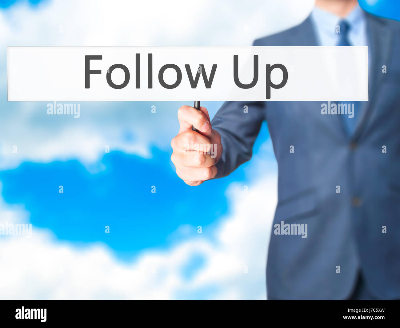 Follow Up - Businessman hand holding sign. Business, technology ...