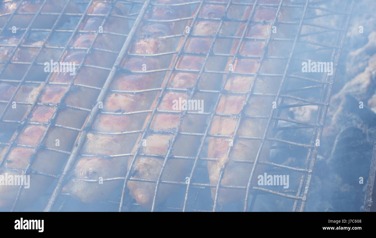 Grilled sausages, cooked on the grill. Barbecue. Still life Stock Photo ...