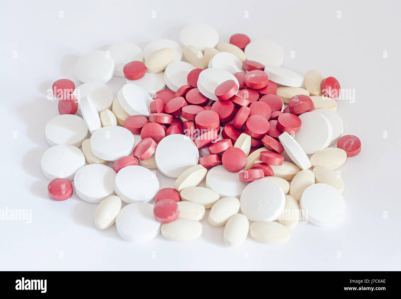 Red, white and yellow drugs pills, powder, bunch, medical, homeopathic ...