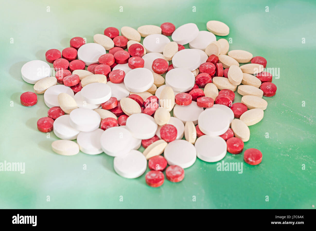 Red, white and yellow drugs pills, powder, bunch, medical, homeopathic ...