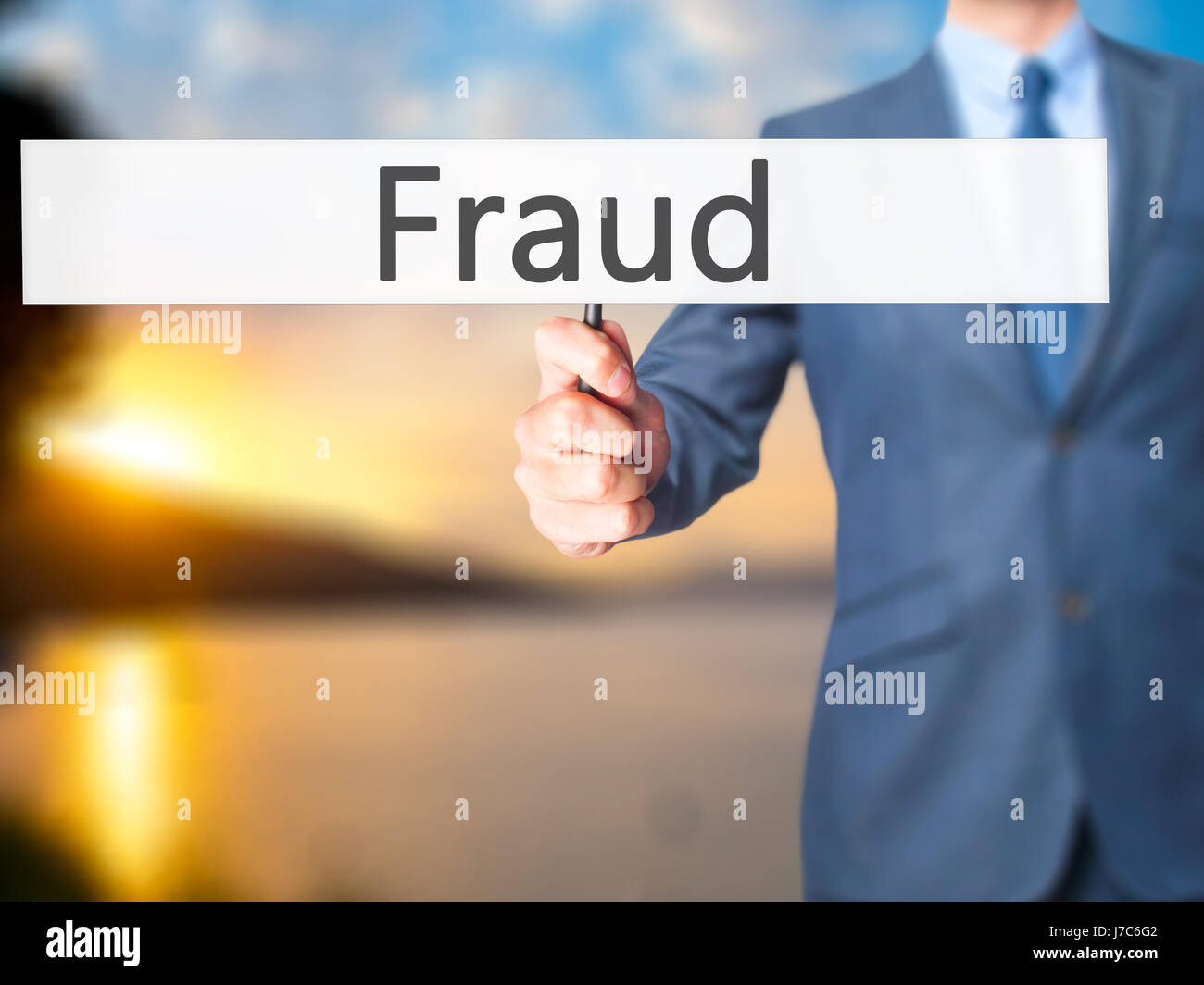 Fraud - Businessman hand holding sign. Business, technology, internet ...
