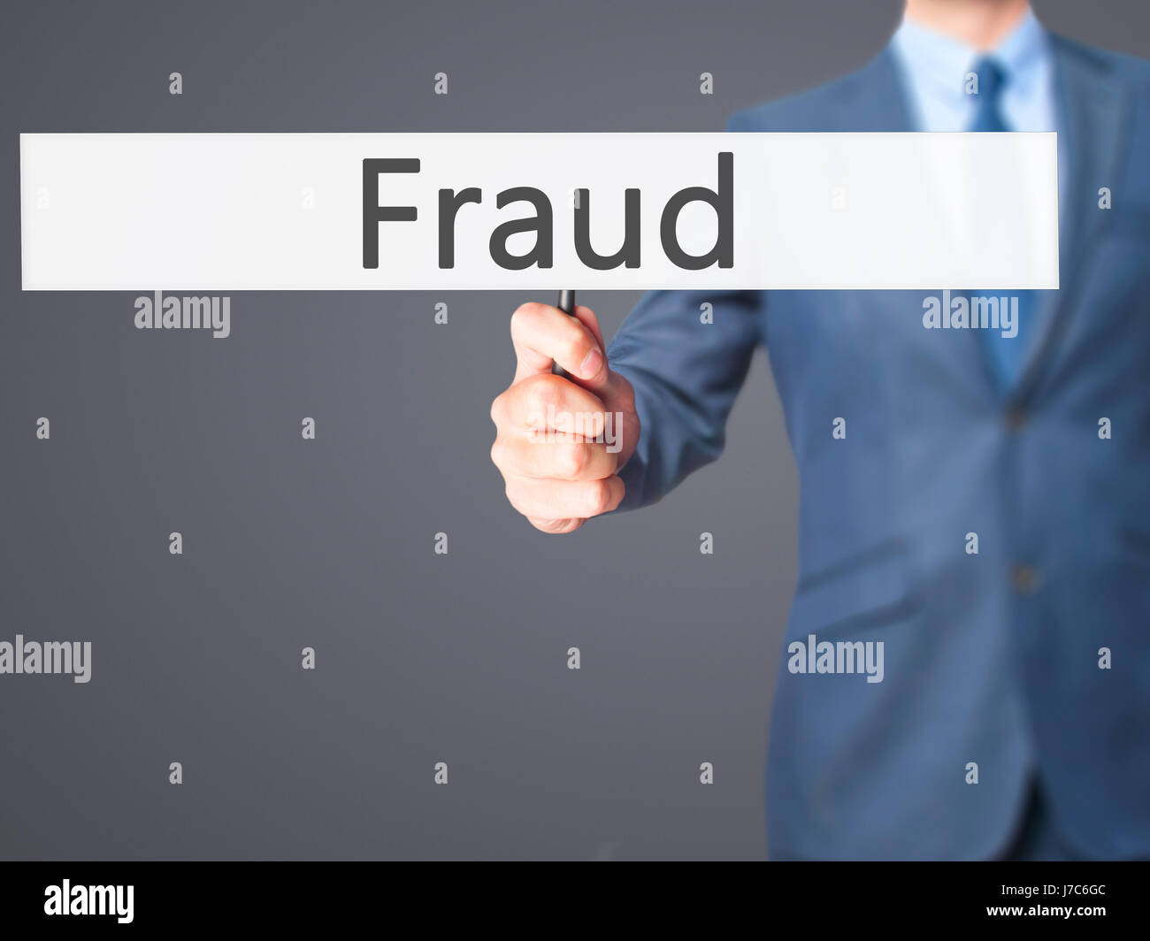 Fraud - Businessman hand holding sign. Business, technology, internet ...