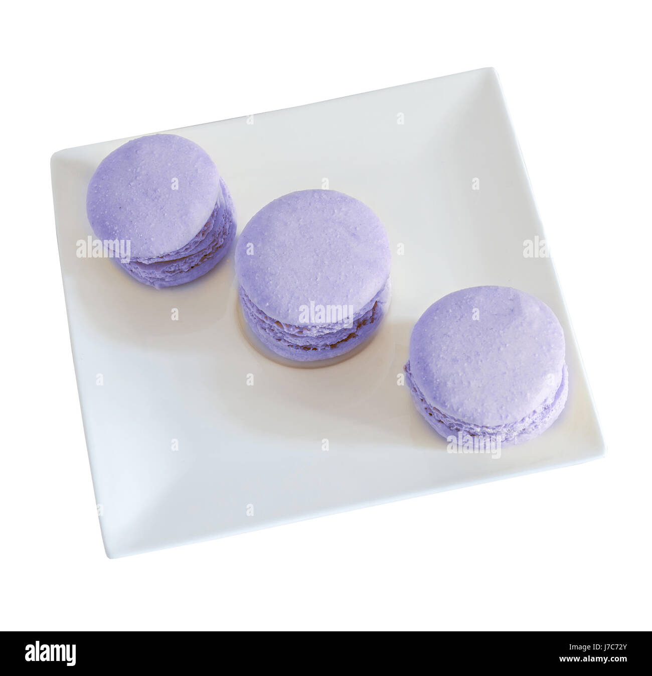 Mauve sweet macaroons, french traditional, cream, white plate, close up ...
