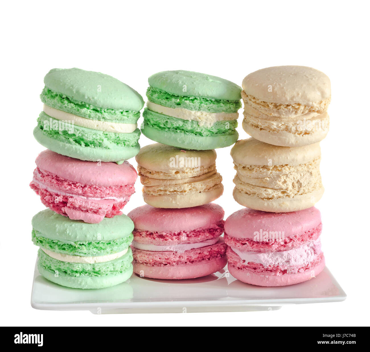 Multi colored sweet macaroons, french traditional, cream, white plate ...