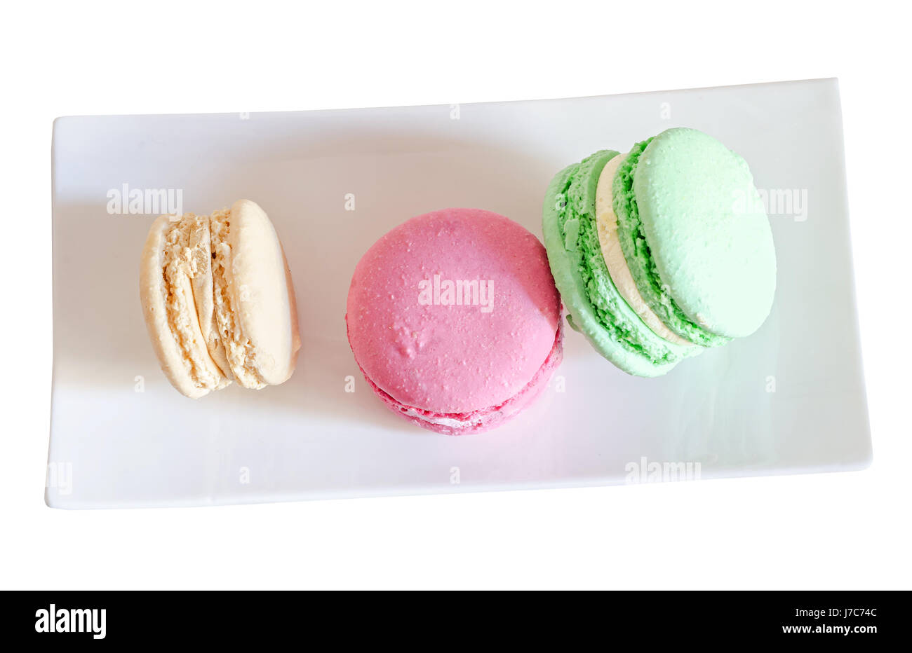 Multi colored sweet macaroons, french traditional, cream, white plate ...