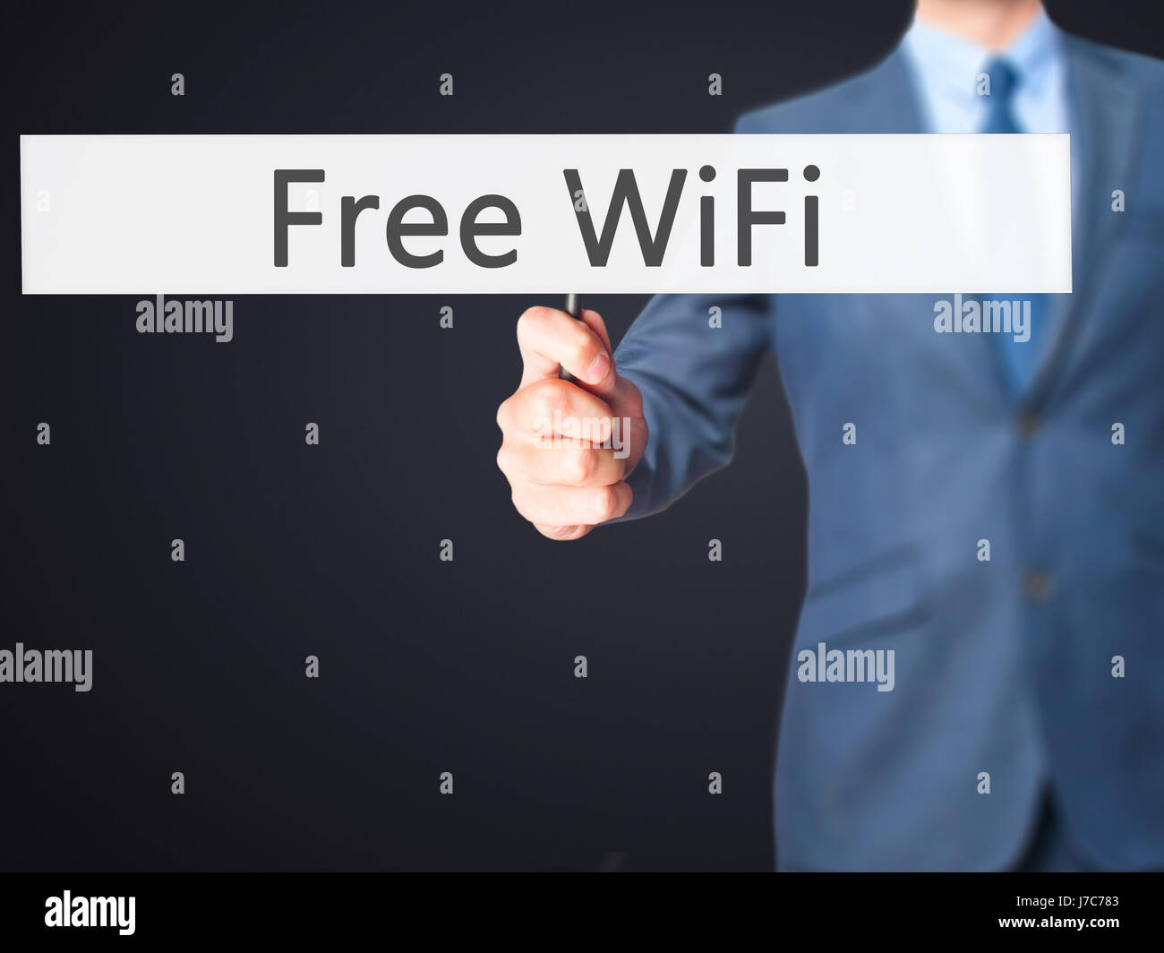 Free WiFi - Businessman hand holding sign. Business, technology ...