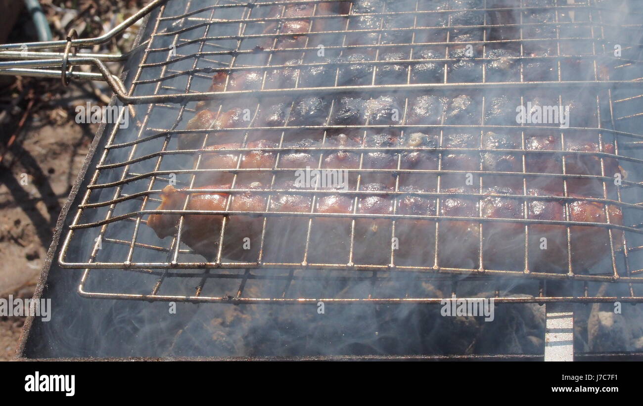 Grilled sausages, cooked on the grill. Barbecue. Still life Stock Photo ...