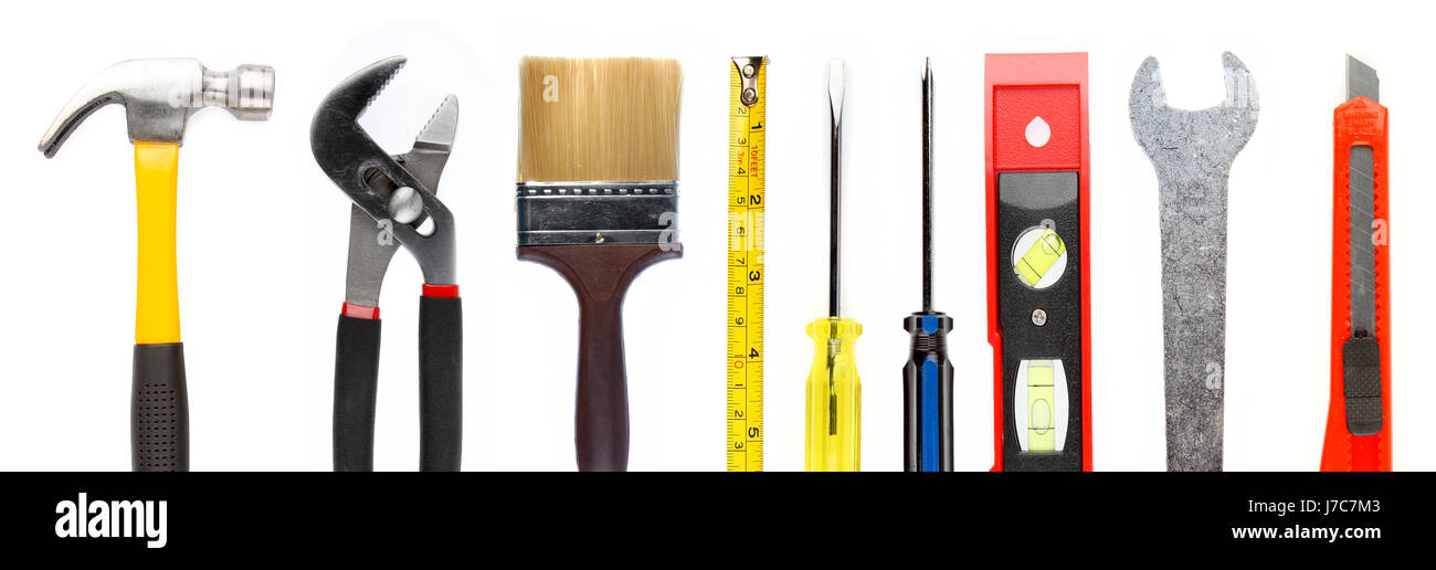Assortment of tools on plain background Stock Photo - Alamy