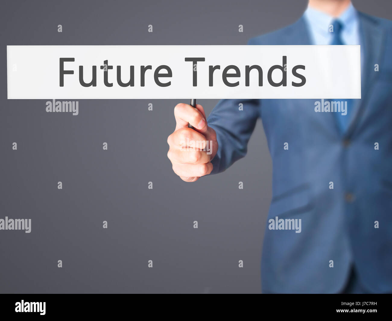 Future Trends - Businessman hand holding sign. Business, technology ...