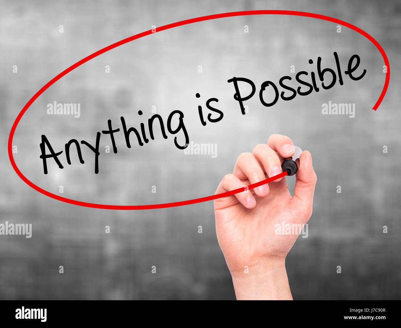 Man Hand writing Anything is Possible with black marker on visual ...