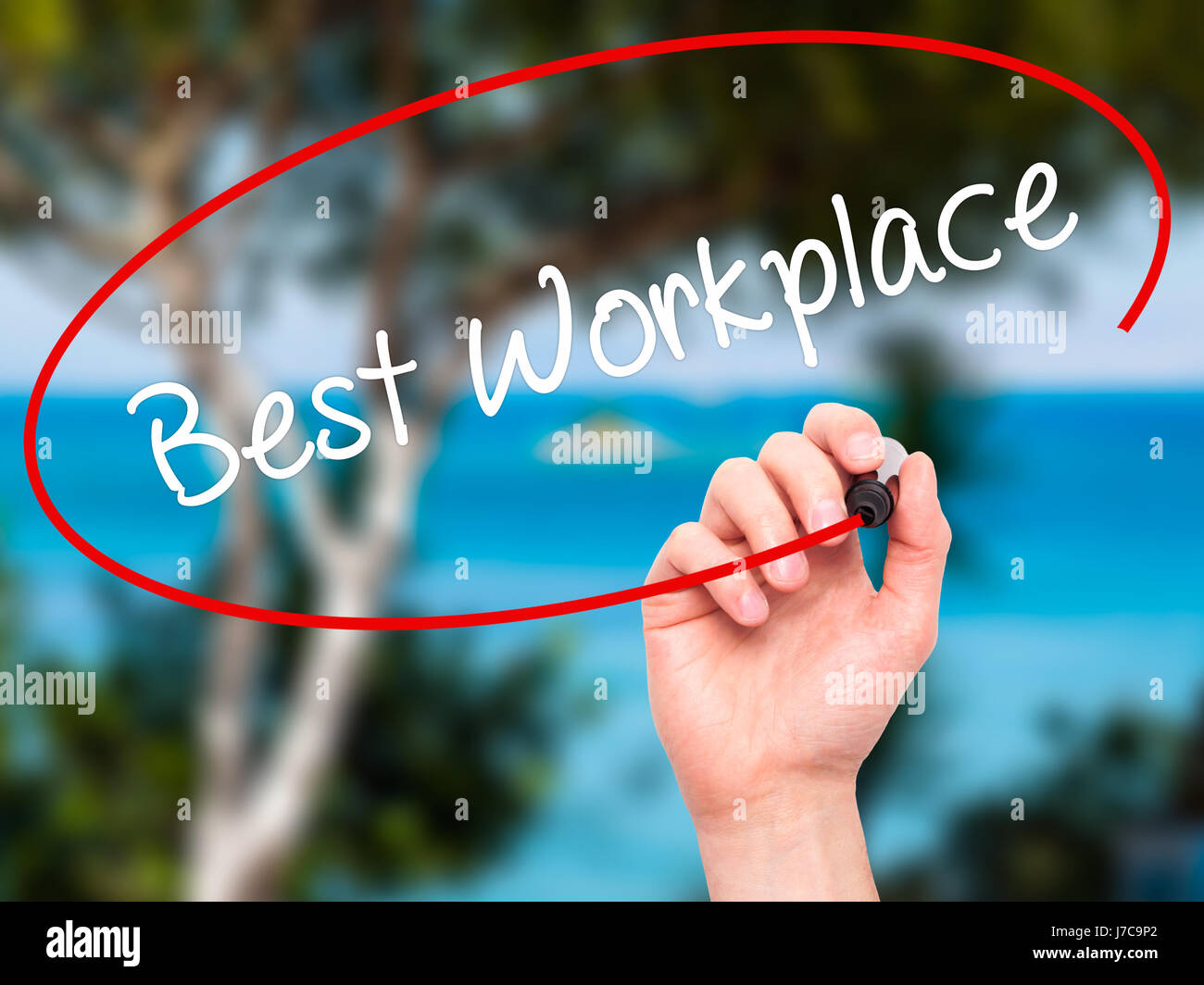 Man Hand writing Best Workplace with black marker on visual screen ...