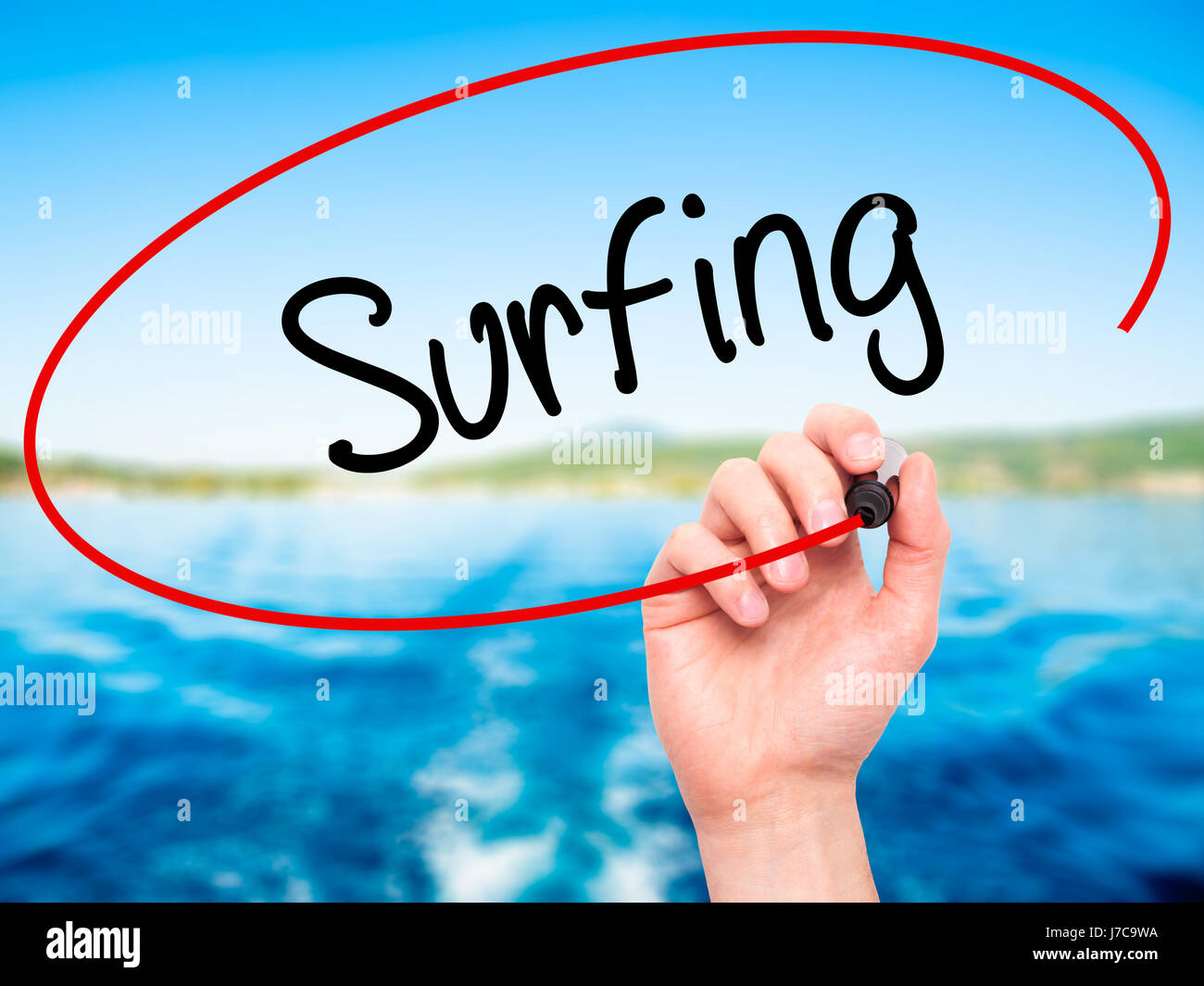 Man Hand writing Surfing with black marker on visual screen. Isolated ...