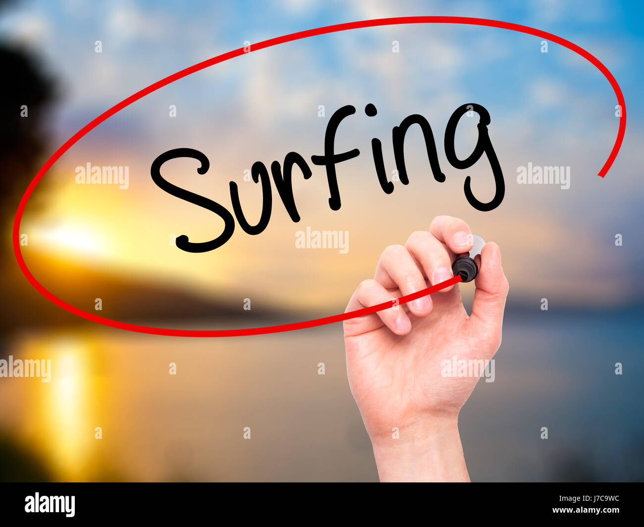 Man Hand writing Surfing with black marker on visual screen. Isolated ...