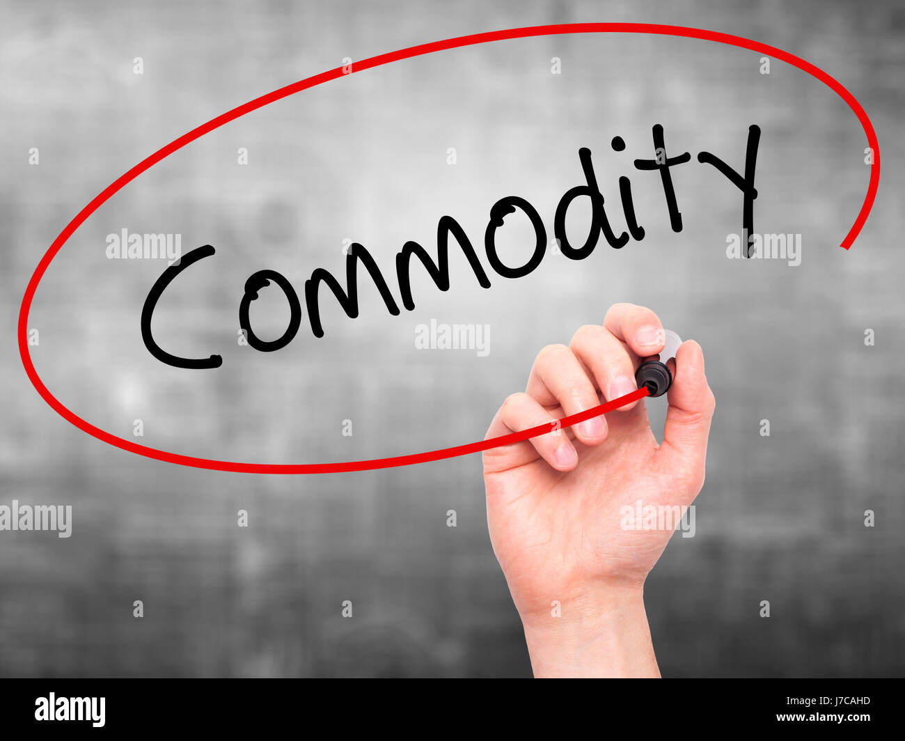Man Hand writing Commodity with black marker on visual screen. Isolated ...