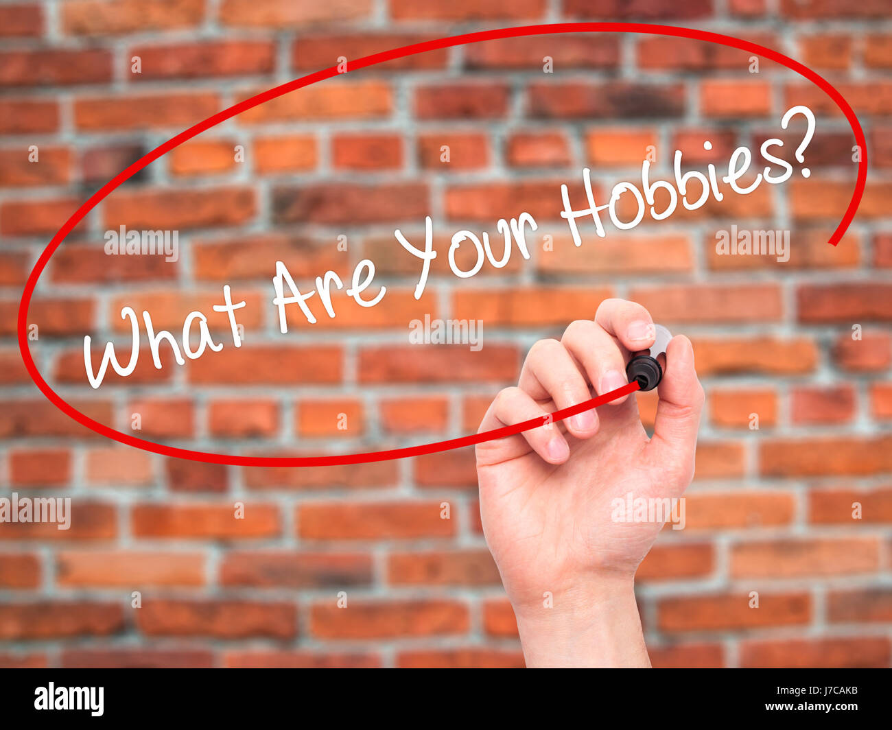Man Hand writing What Are Your Hobbies? with black marker on visual ...
