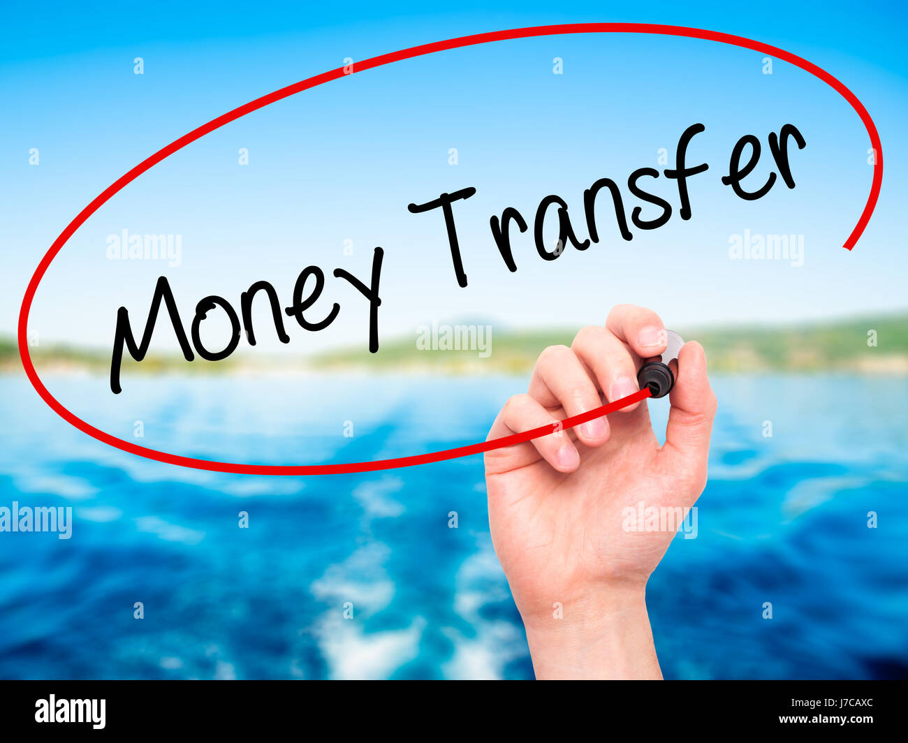 Man Hand writing Money Transfer with black marker on visual screen ...