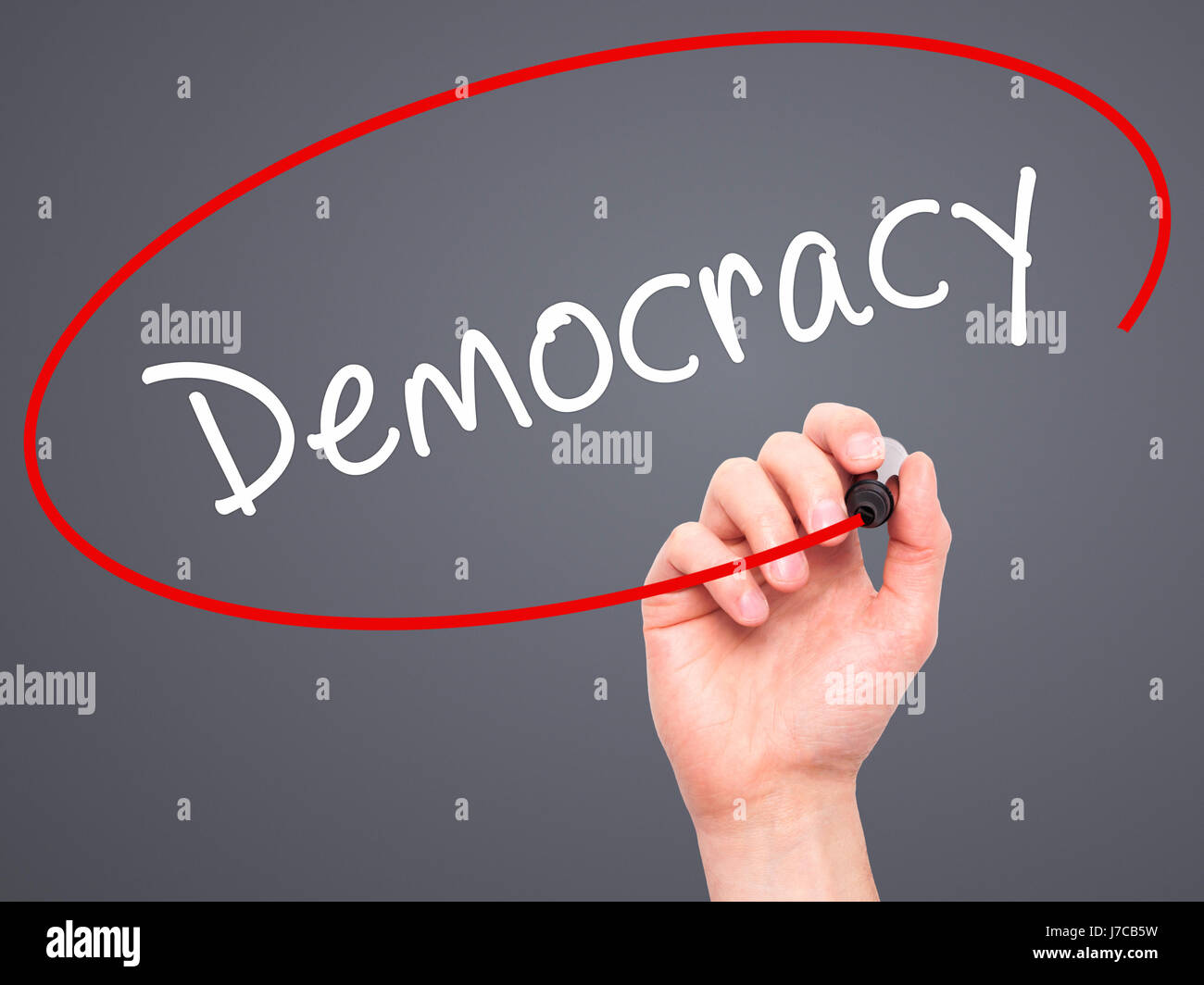 Man Hand writing Democracy with black marker on visual screen. Isolated ...