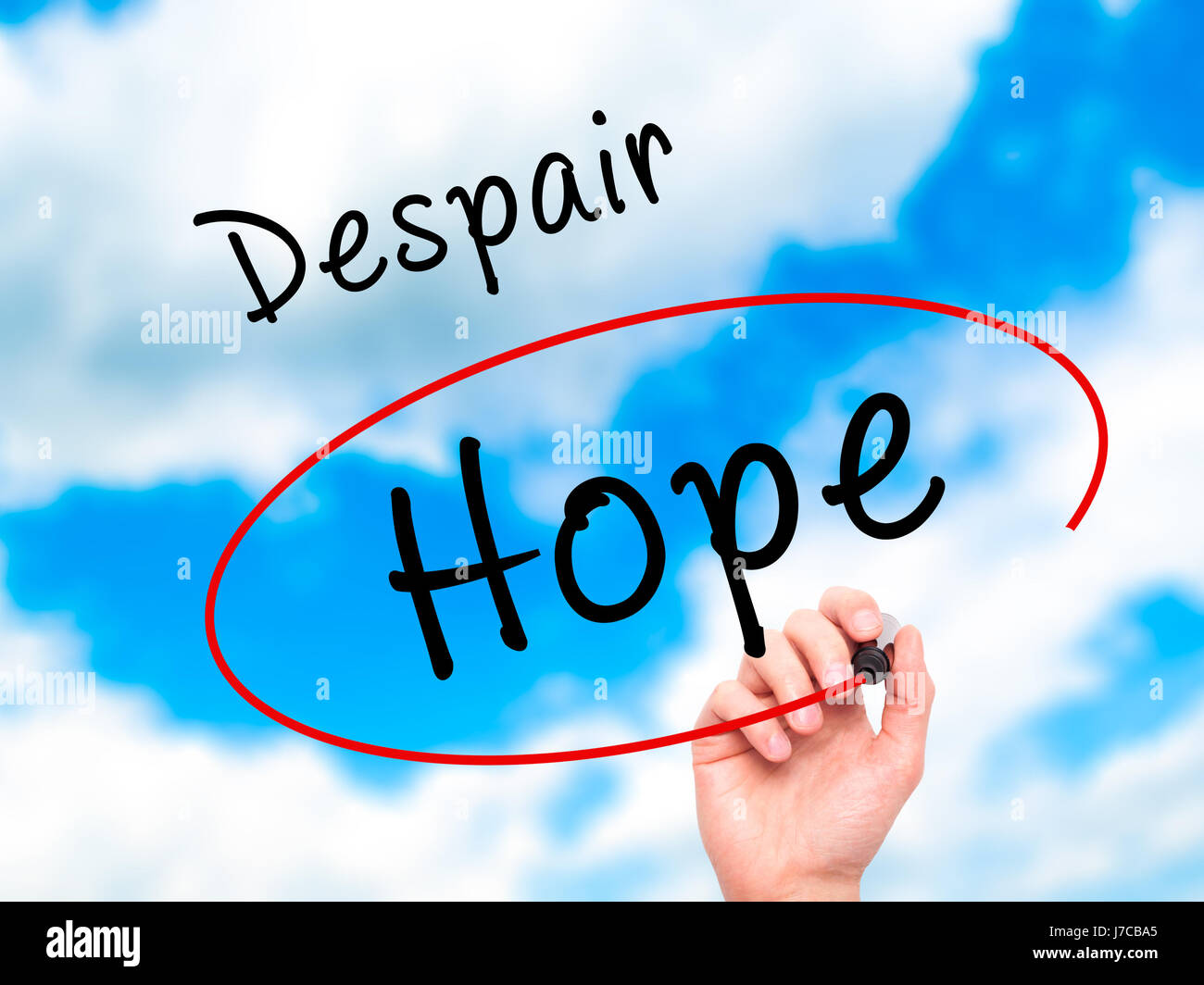 Man Hand writing and choosing Hope instead of Despair with black marker ...