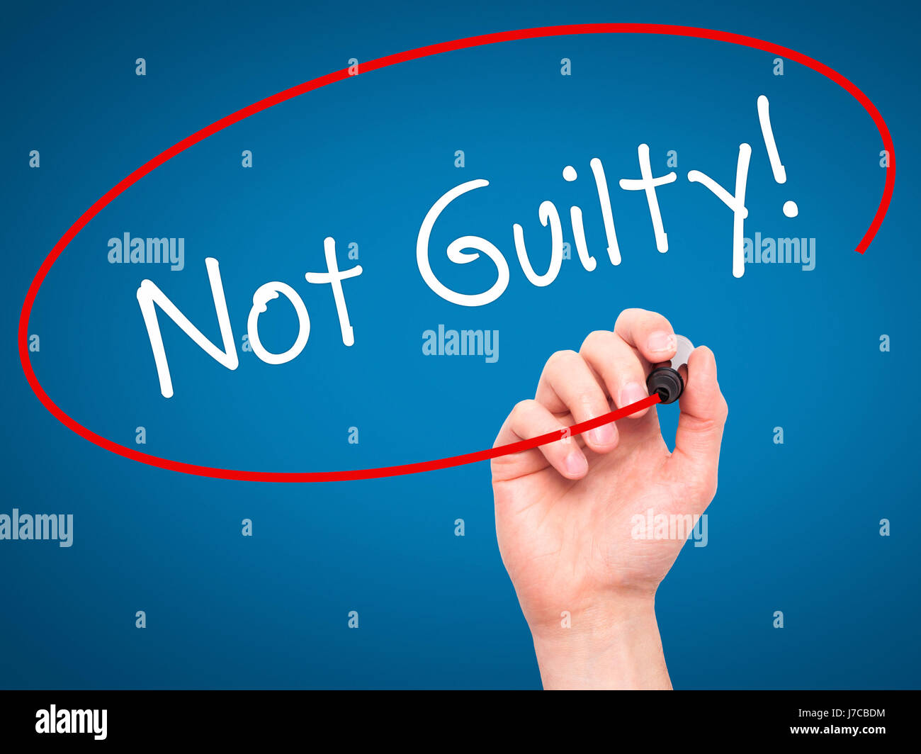 Man Hand writing NOT GUILTY with black marker on visual screen ...