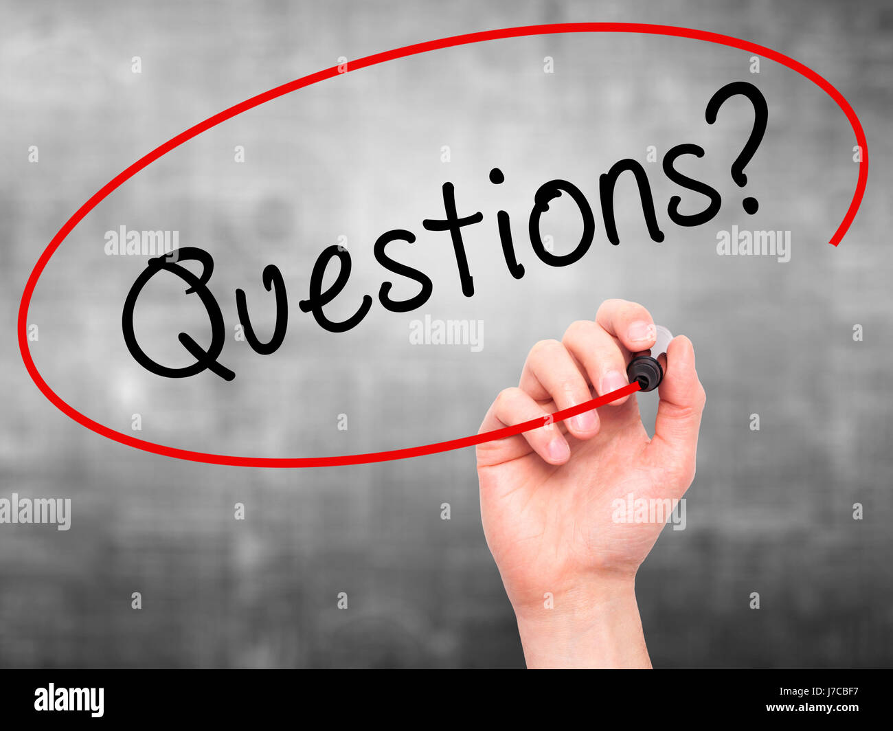 Man Hand writing Questions? with black marker on visual screen ...