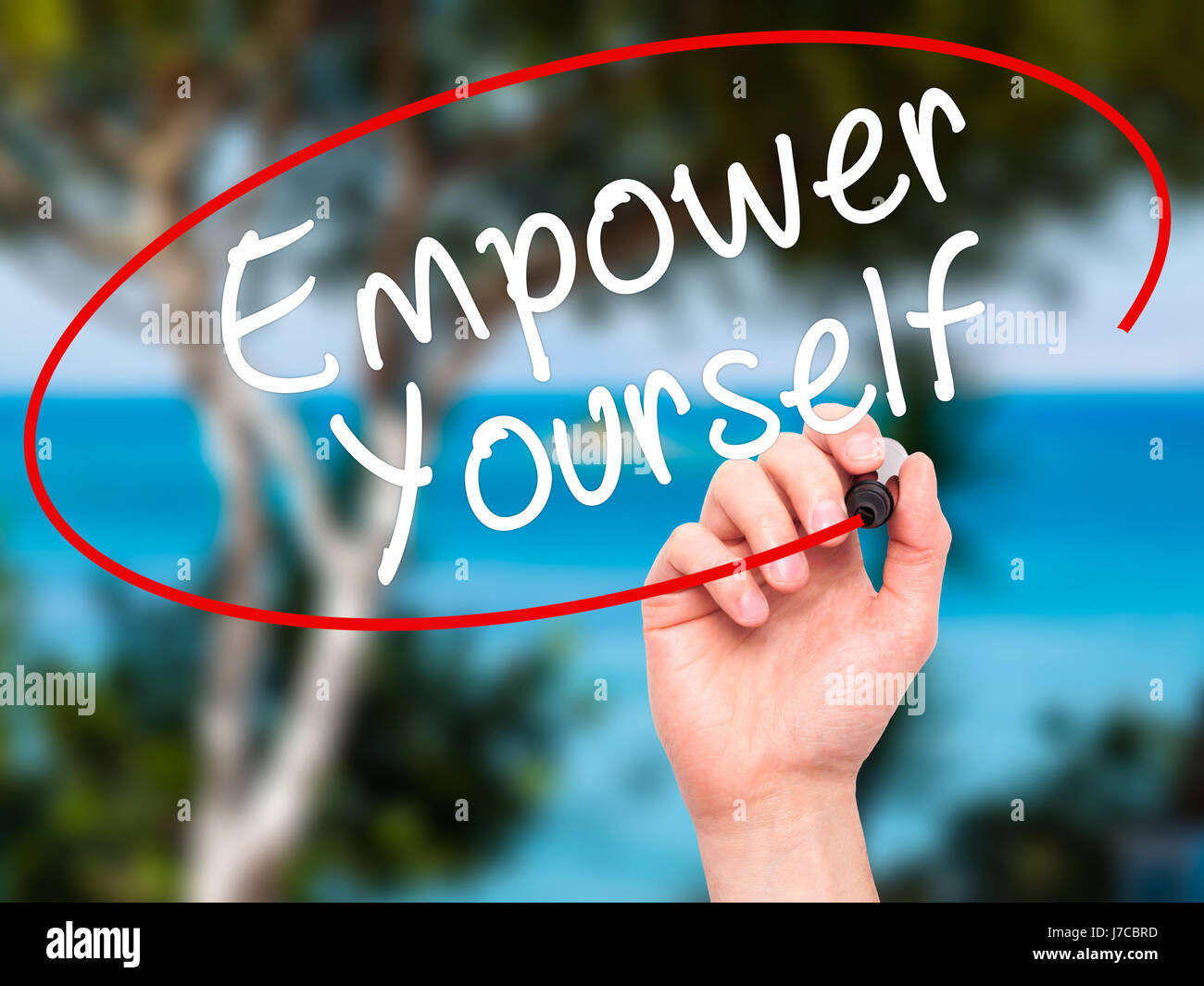 Man Hand writing Empower Yourself with black marker on visual screen ...