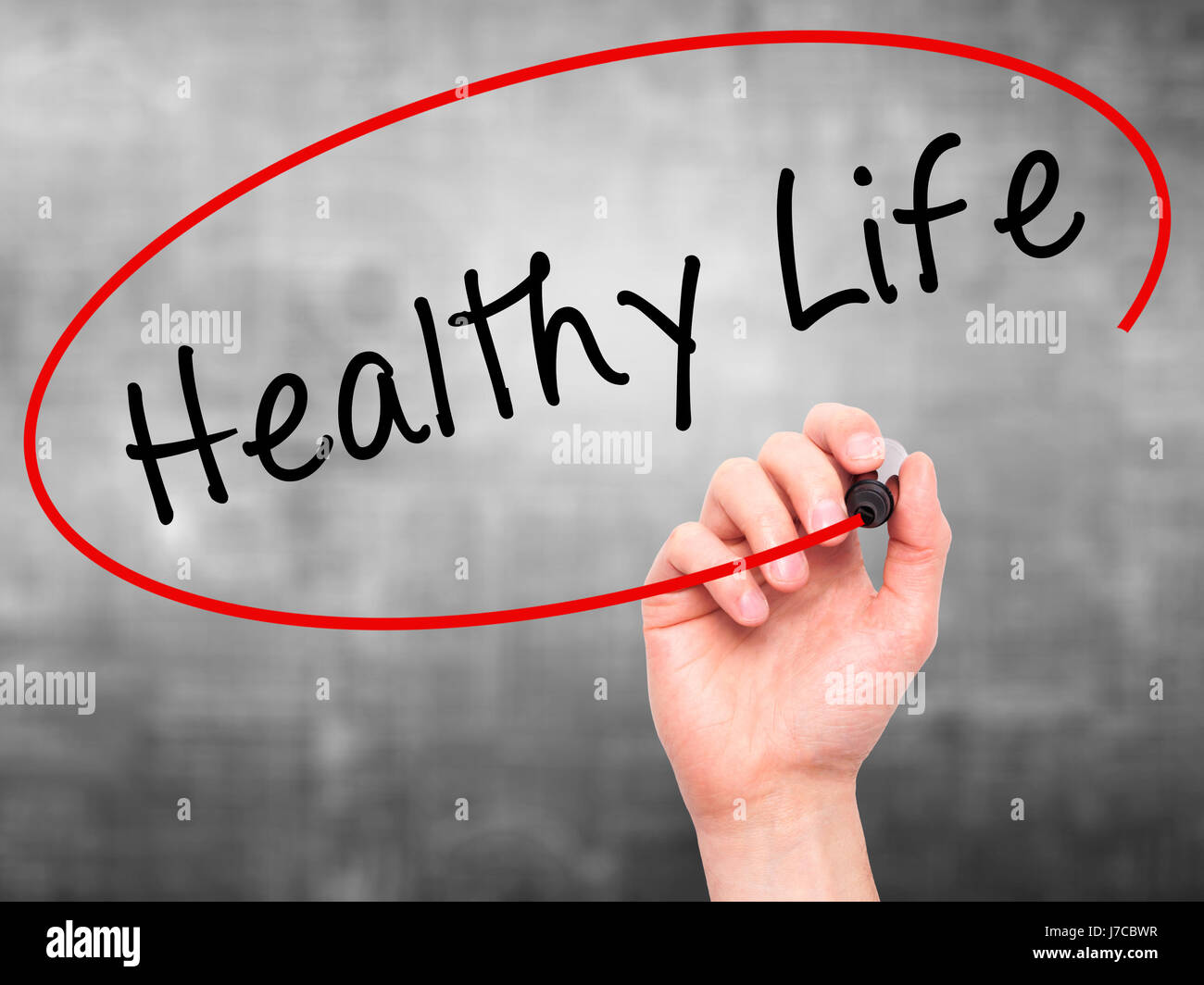 Man Hand writing Healthy Life black marker on visual screen. Isolated ...