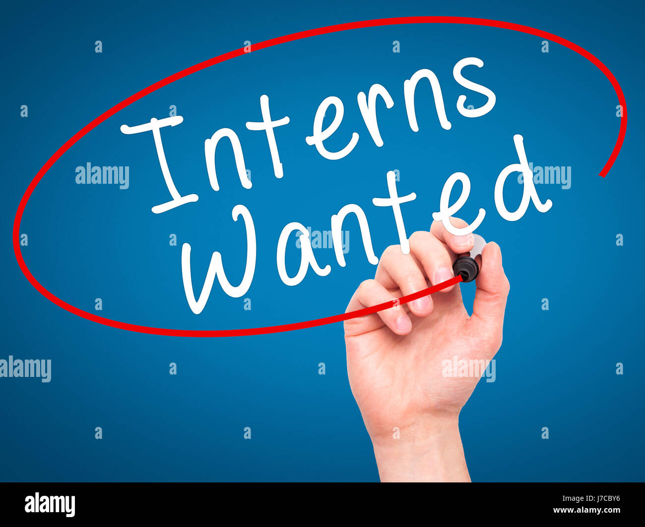 Man Hand writing Interns Wanted with black marker on visual screen ...