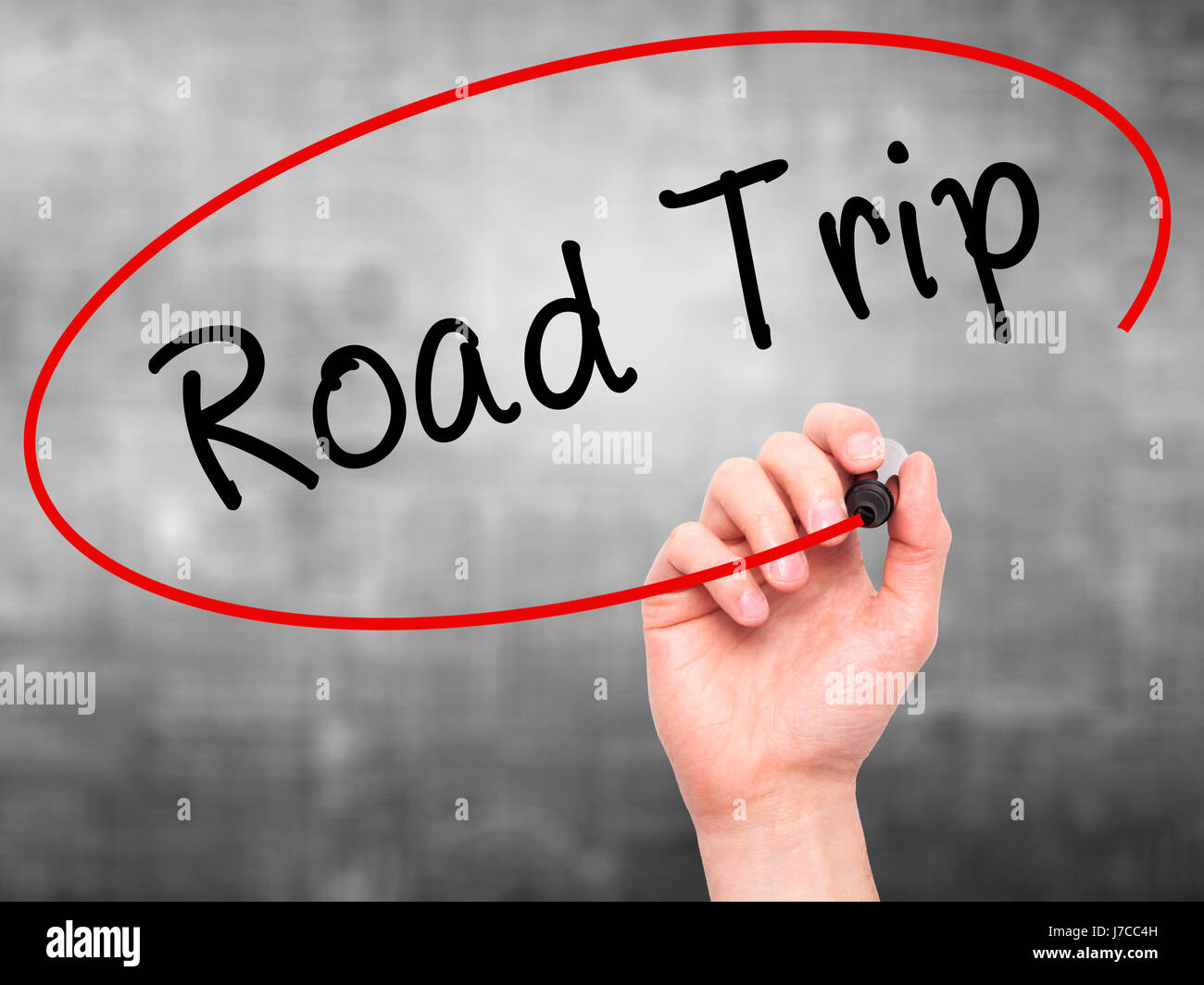 Man Hand writing Road Trip with black marker on visual screen. Isolated ...