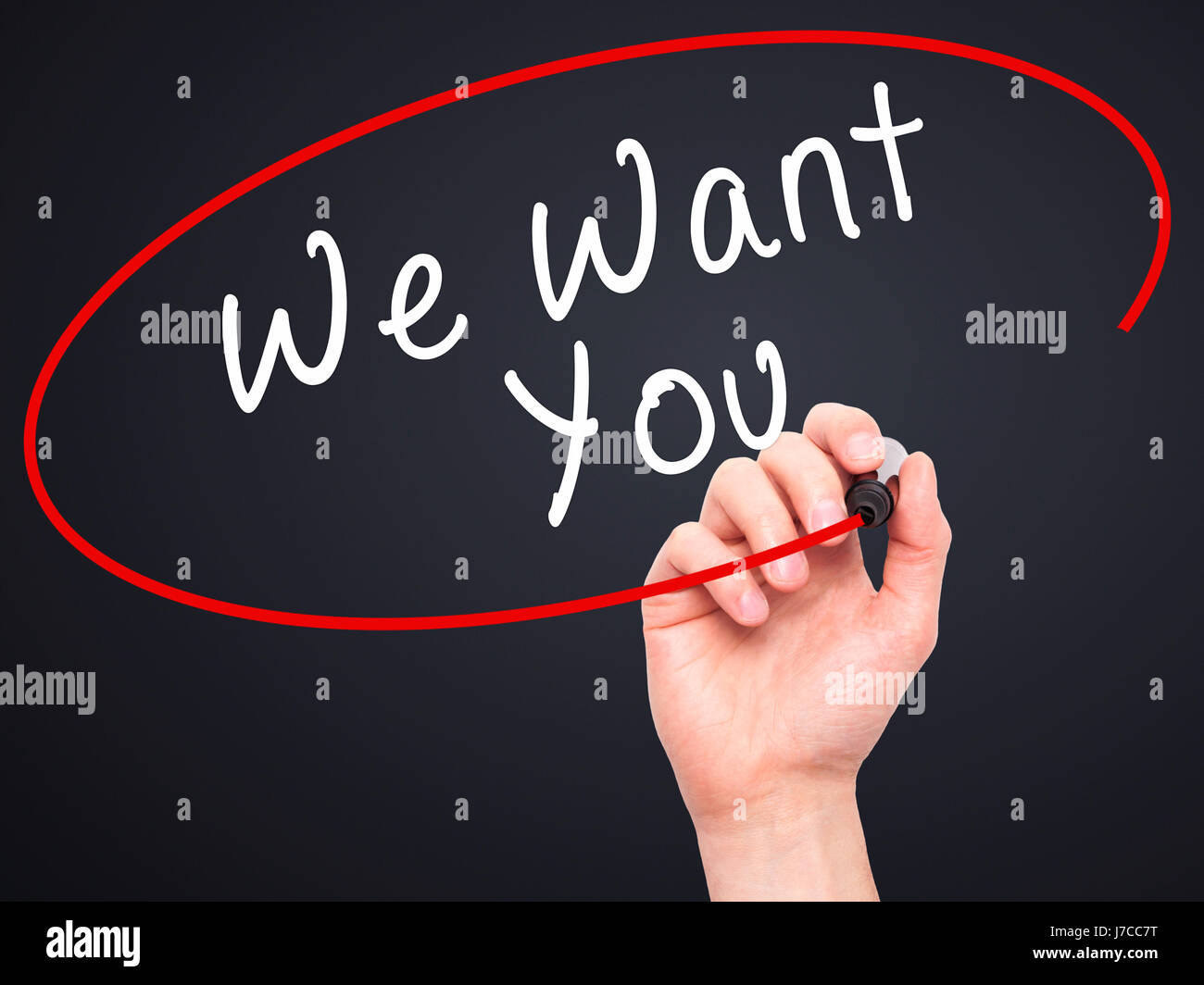 Man Hand writing We Want You with black marker on visual screen ...