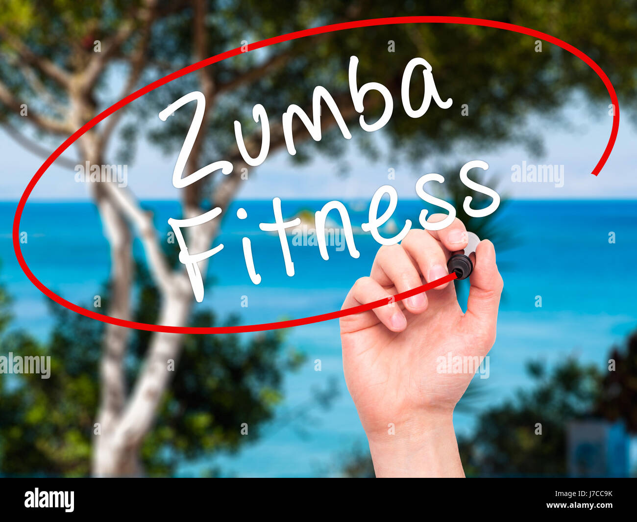 Man Hand writing Zumba Fitness with black marker on visual screen ...