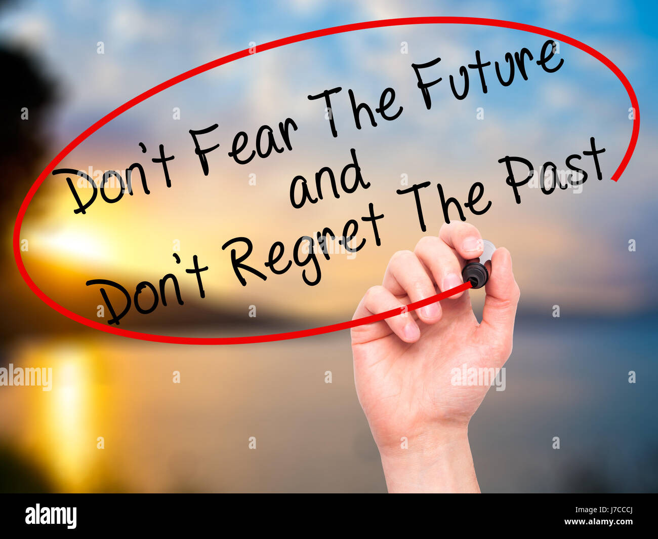 Man Hand writing Don't Fear The Future and Don't Regret The Past with ...