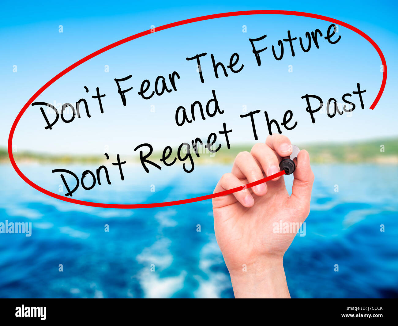 Man Hand writing Don't Fear The Future and Don't Regret The Past with ...
