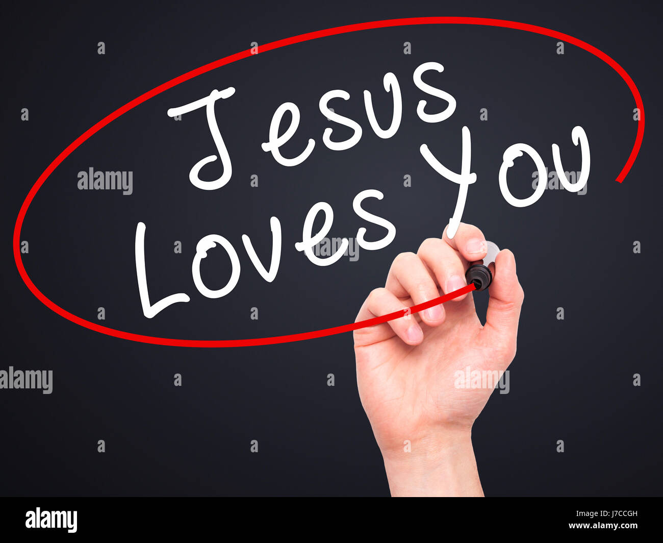 Man Hand writing Jesus Loves You with black marker on visual screen ...