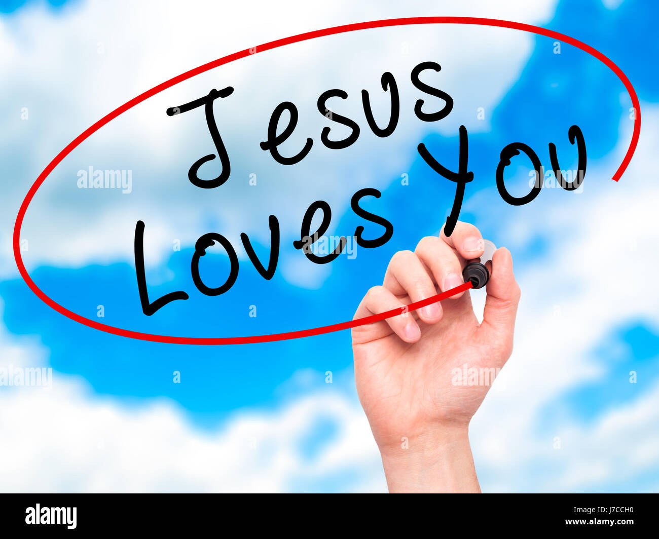 Man Hand writing Jesus Loves You with black marker on visual screen ...