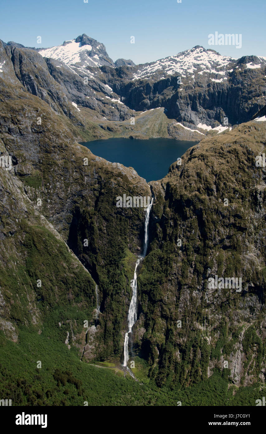 waterfall new zealand mountain lake fresh water lake inland water water ...